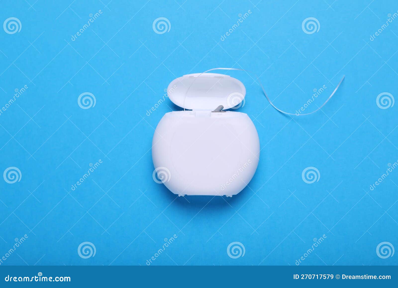 Container with Dental Floss on Light Blue Background, Top View Stock ...