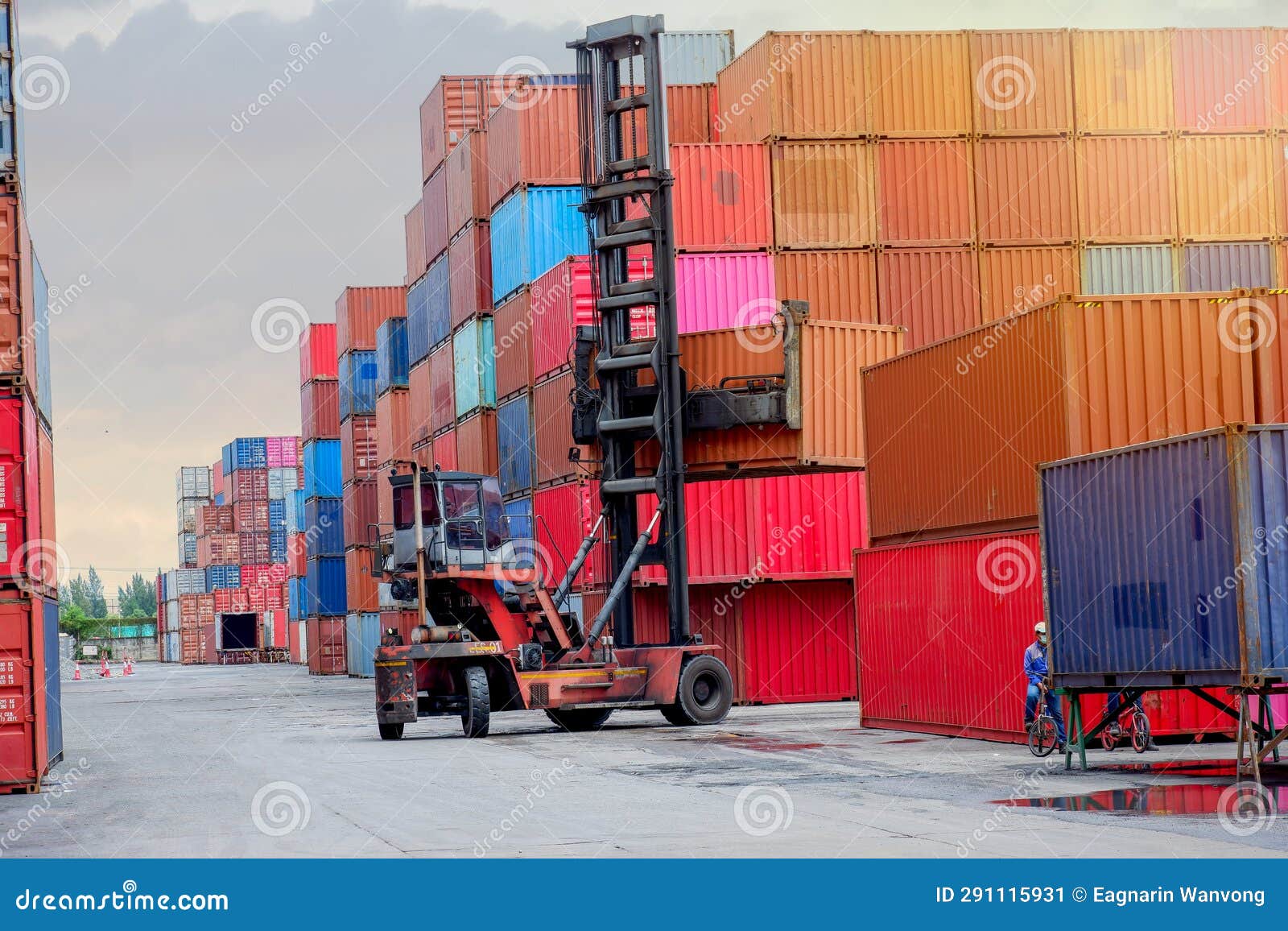 A Container Forklift Sits Behind a Stack of Containers Stock Image ...
