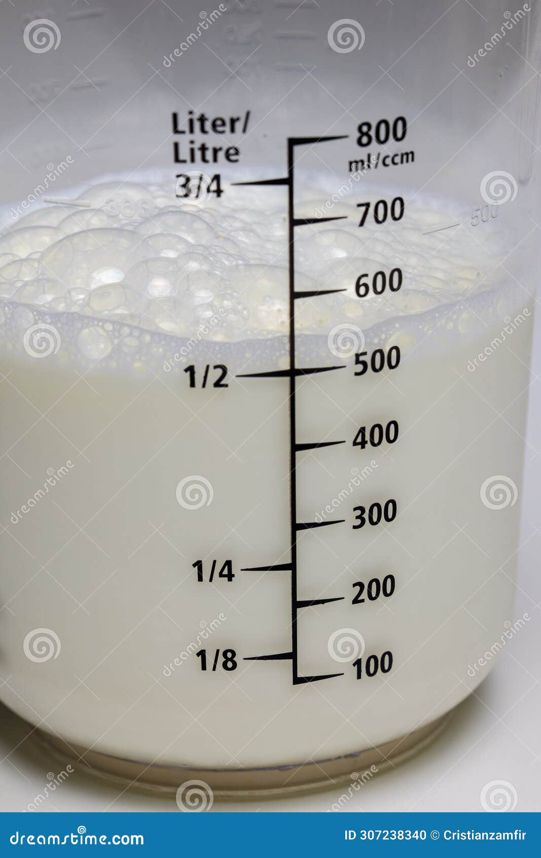A Container with Graduated Milk Stock Photo - Image of equipment, scale ...