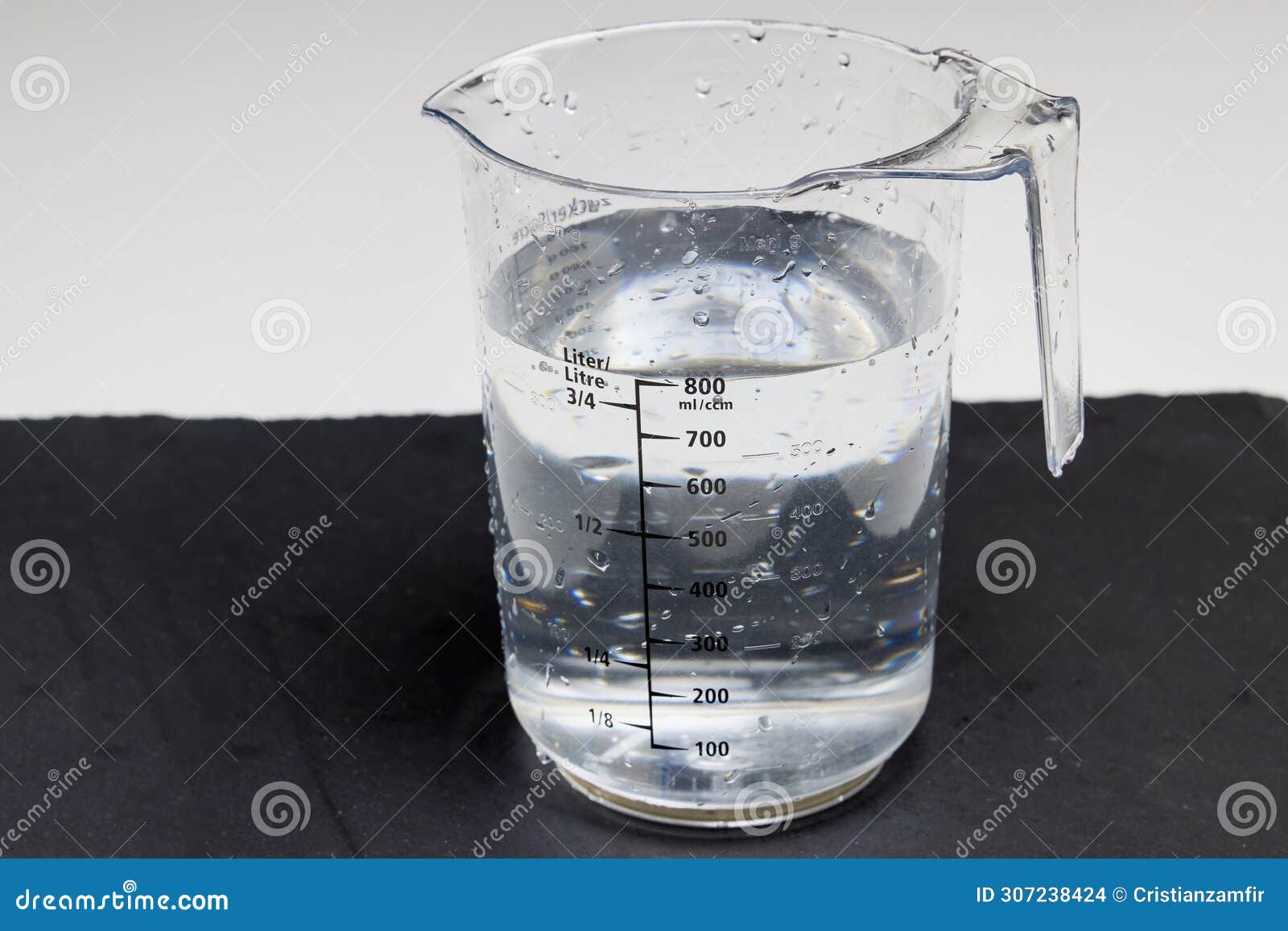 A Container with Graduated Water Stock Photo - Image of cooking ...