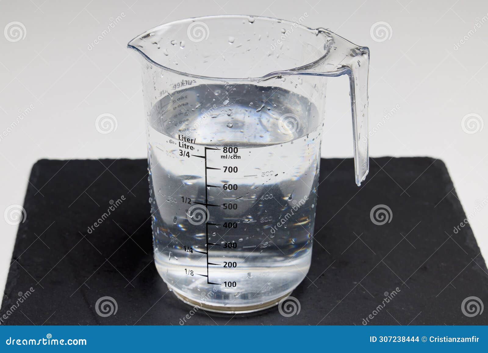 A Container with Graduated Water Stock Photo - Image of cooking ...