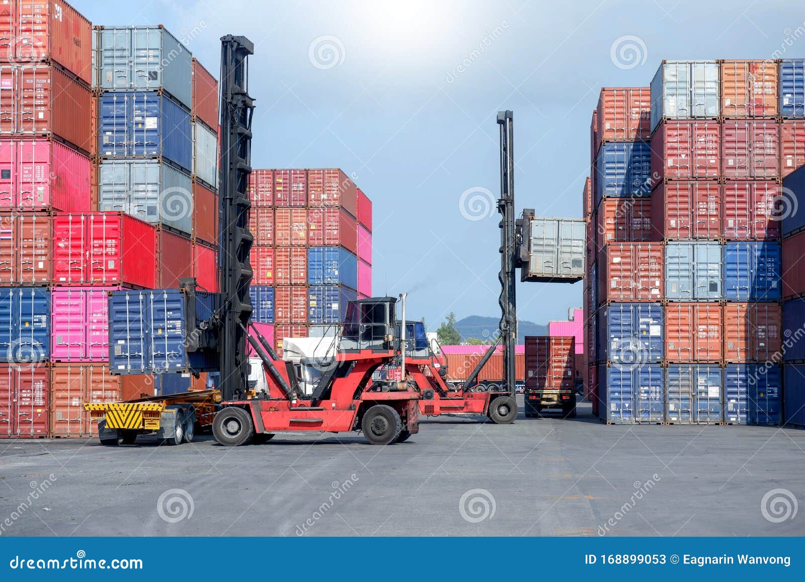 Container Handlers are Loading Containers into Trucks Stock Image ...