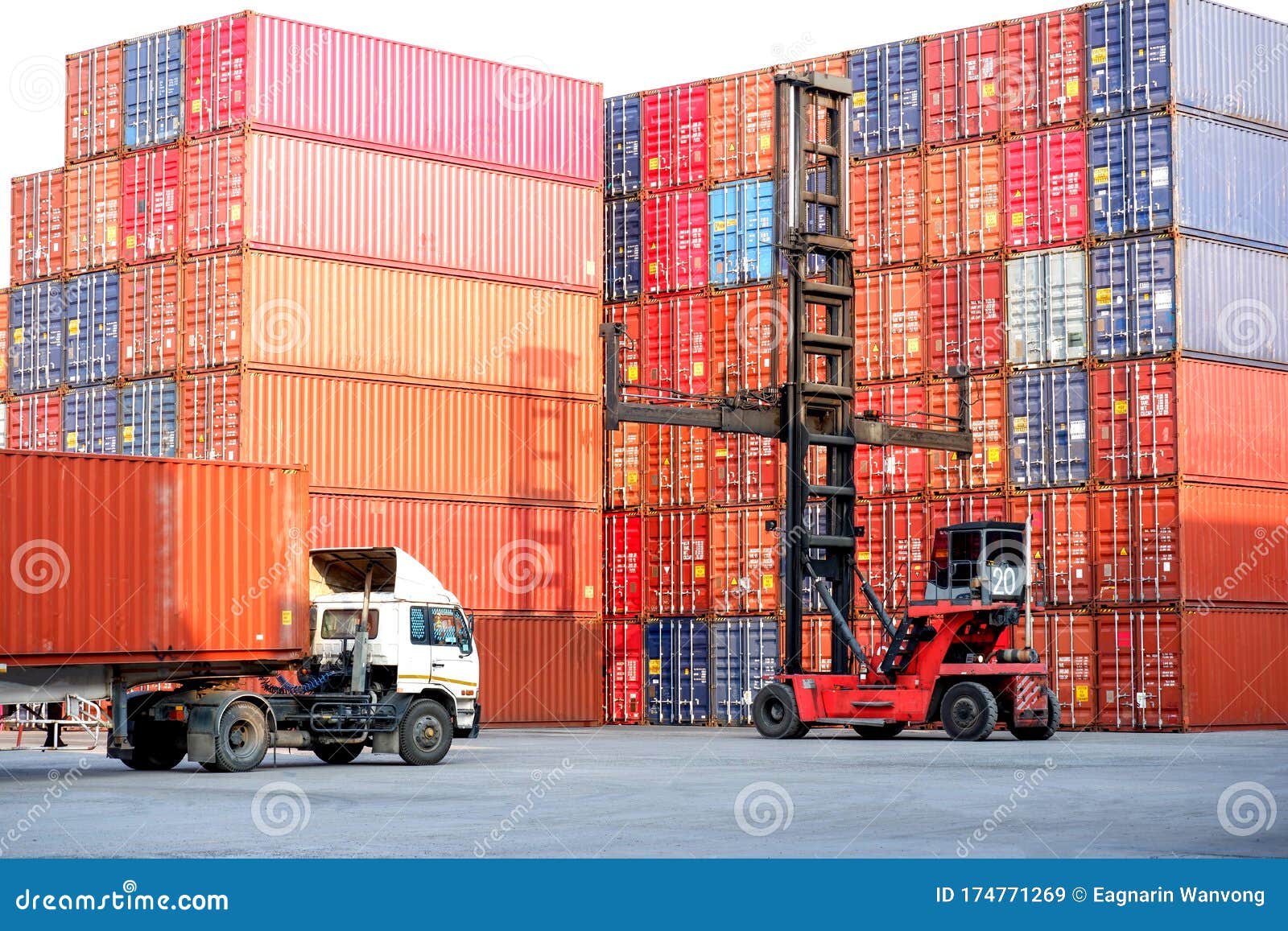 Container Handlers And Trucks In The Loading And Unloading Yard Royalty ...