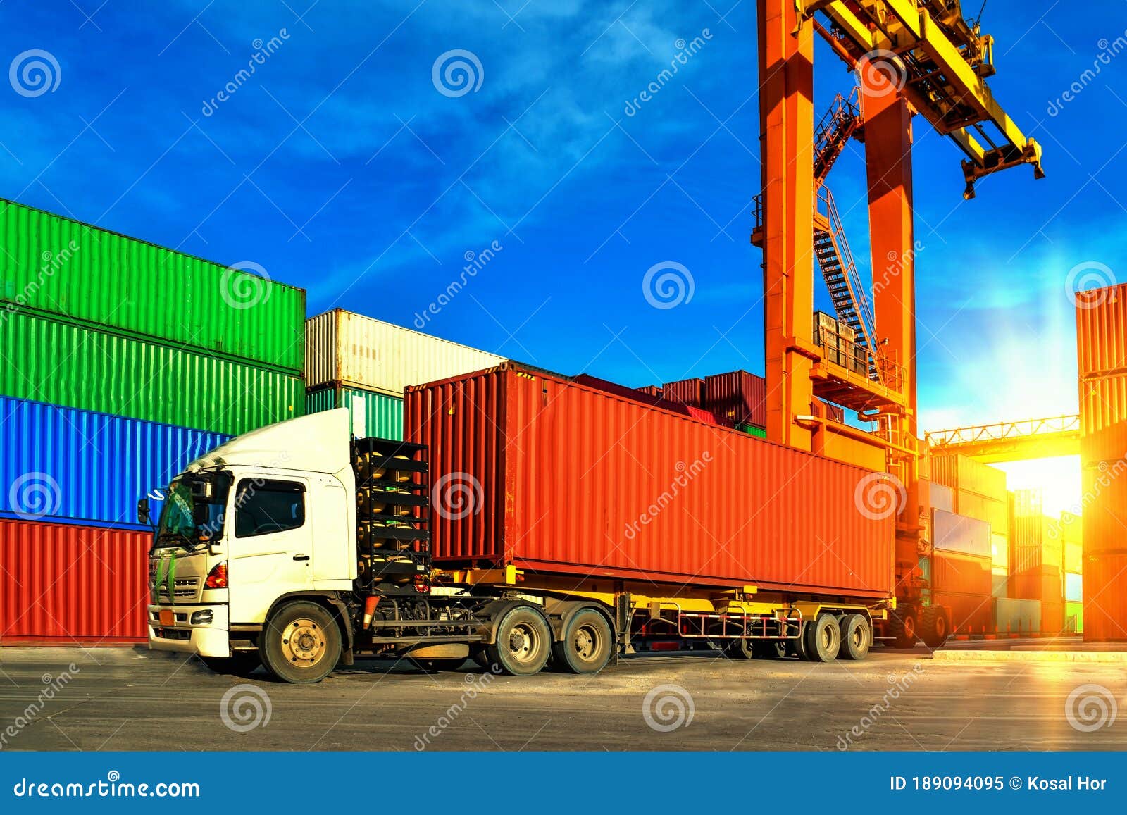Container Handling. Container Truck Picking Up Container at Yard Stock ...