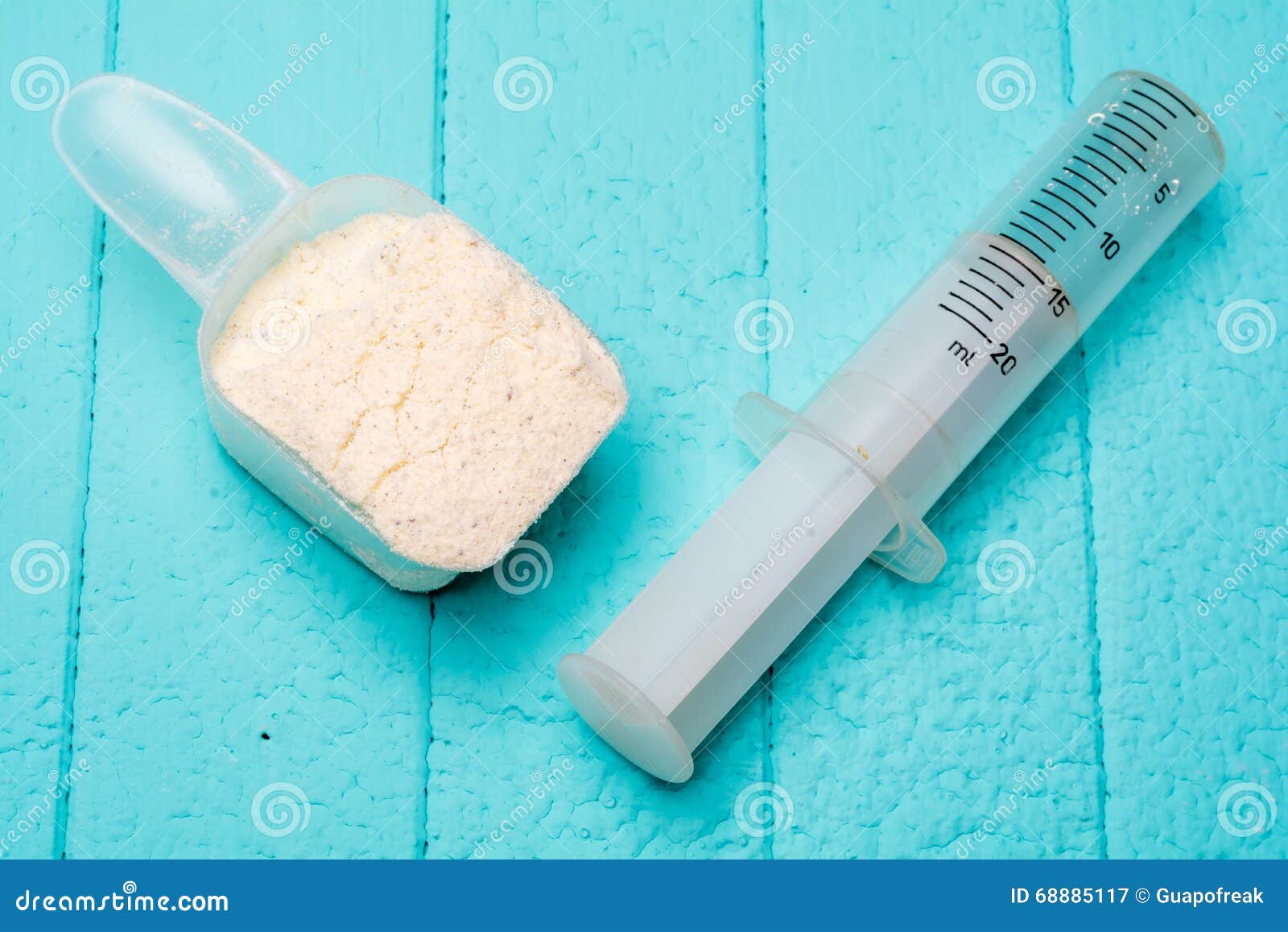 Container of Milk Whey Protein and Empty Injection. Close-up. Blue ...