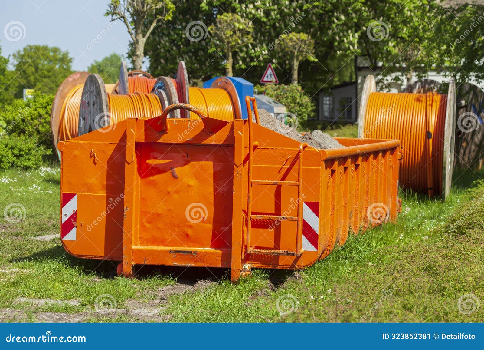 Container, Orange Skip for Building Rubble Standing on a Meadow Stock ...