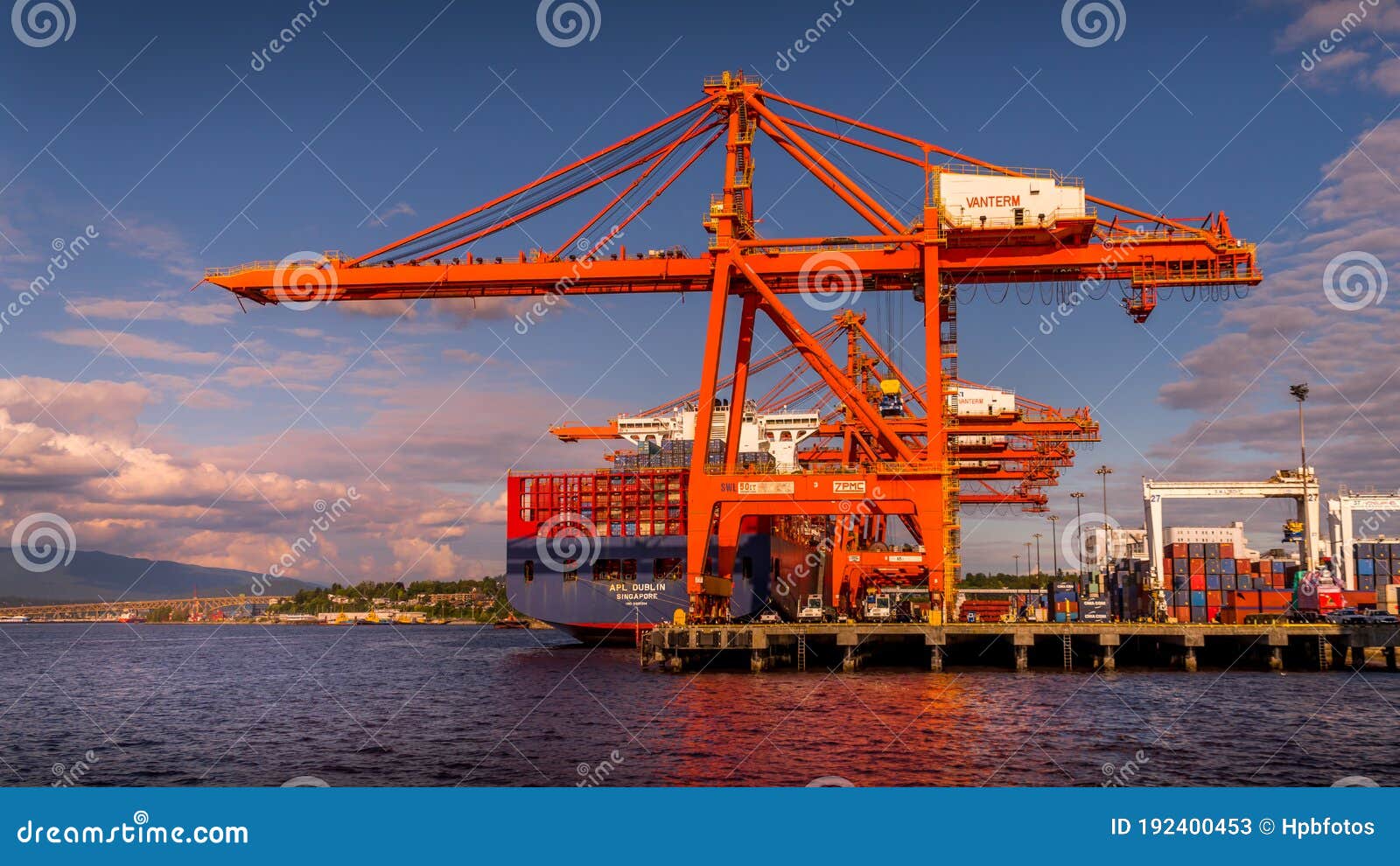 Container Port with the Large Container Cranes Loading a Ocean Going ...
