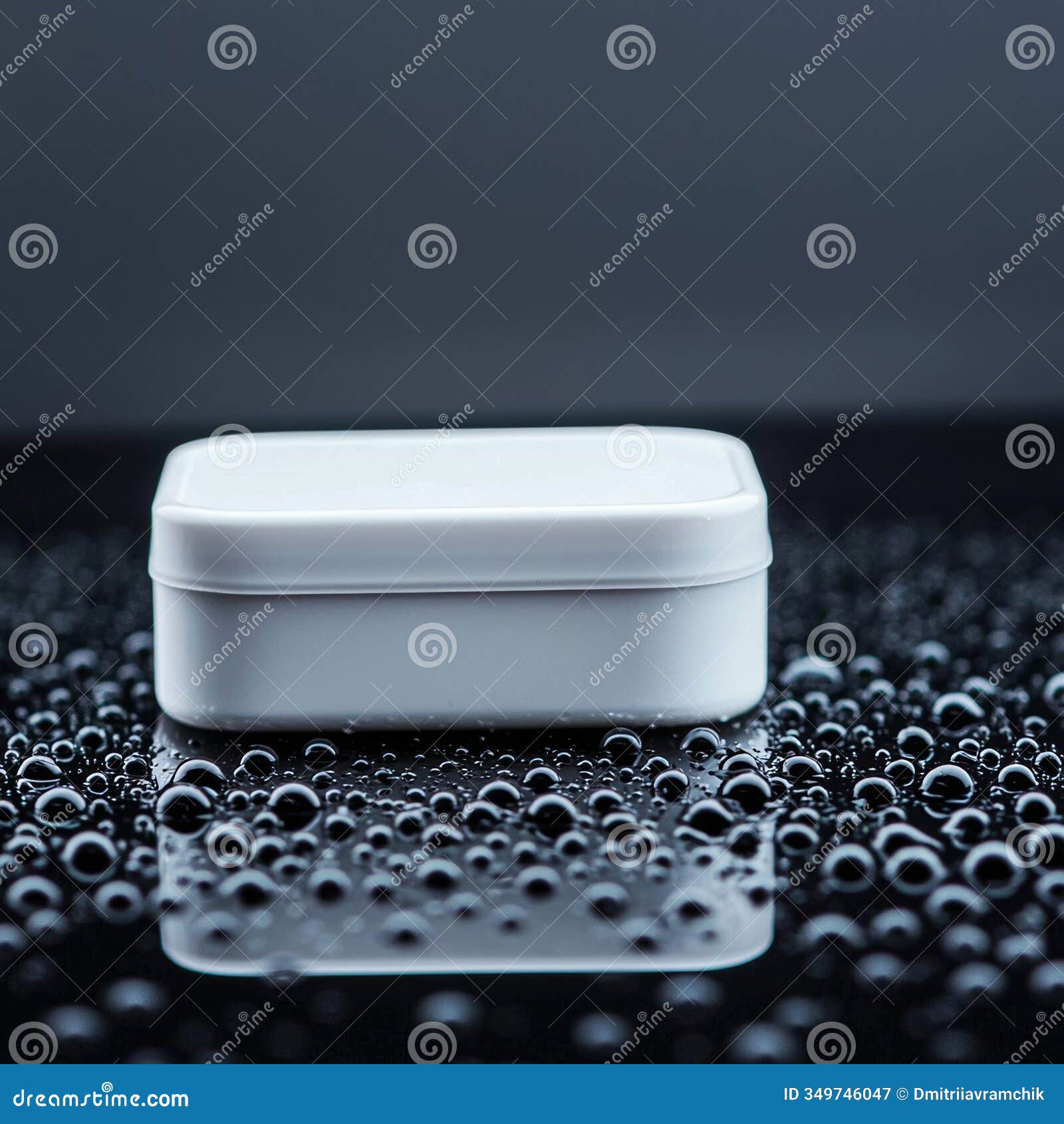 Container with Round Edges Made of White Plastic on a Wet Surface Stock ...
