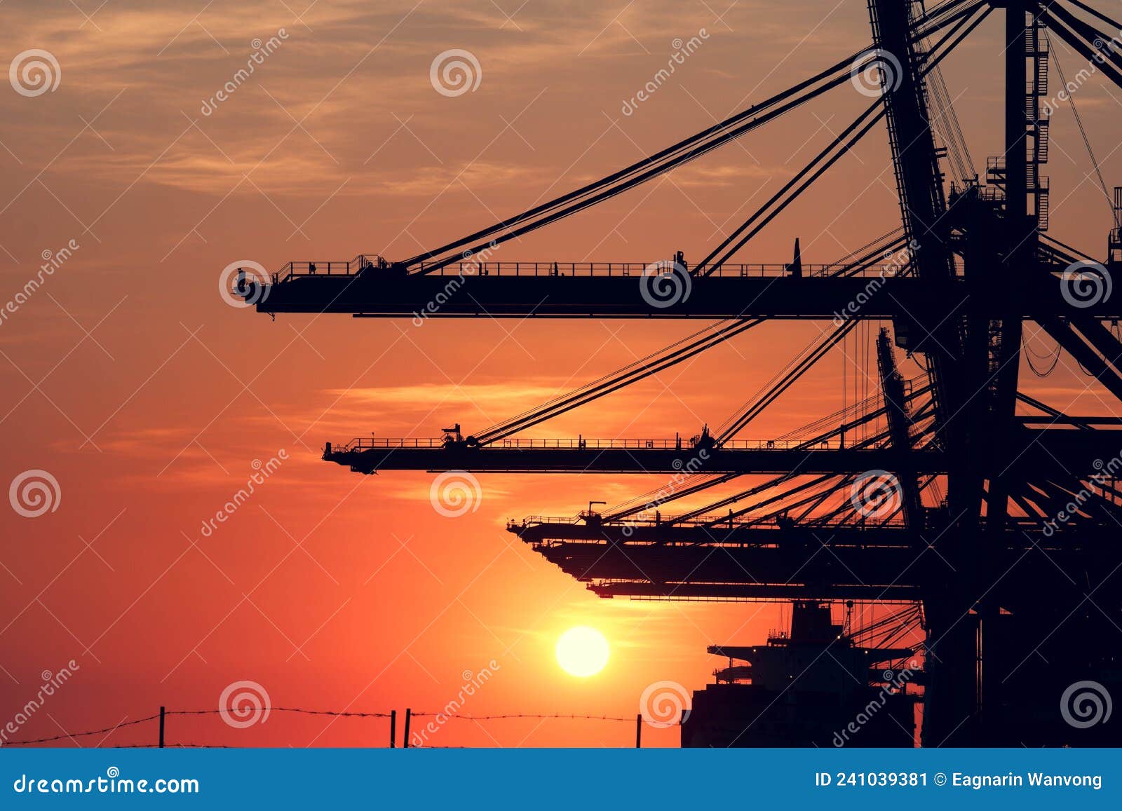 Container Ship with Cranes for Loading Goods in the Port in the Evening ...