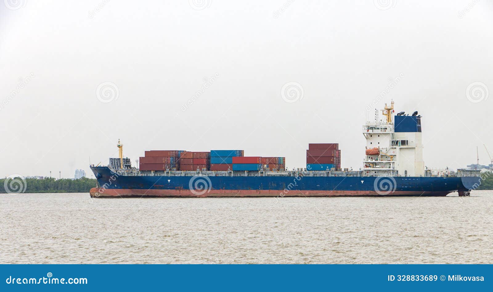 The Container Ship Loaded of Containers Sail beside a Seashore Stock ...