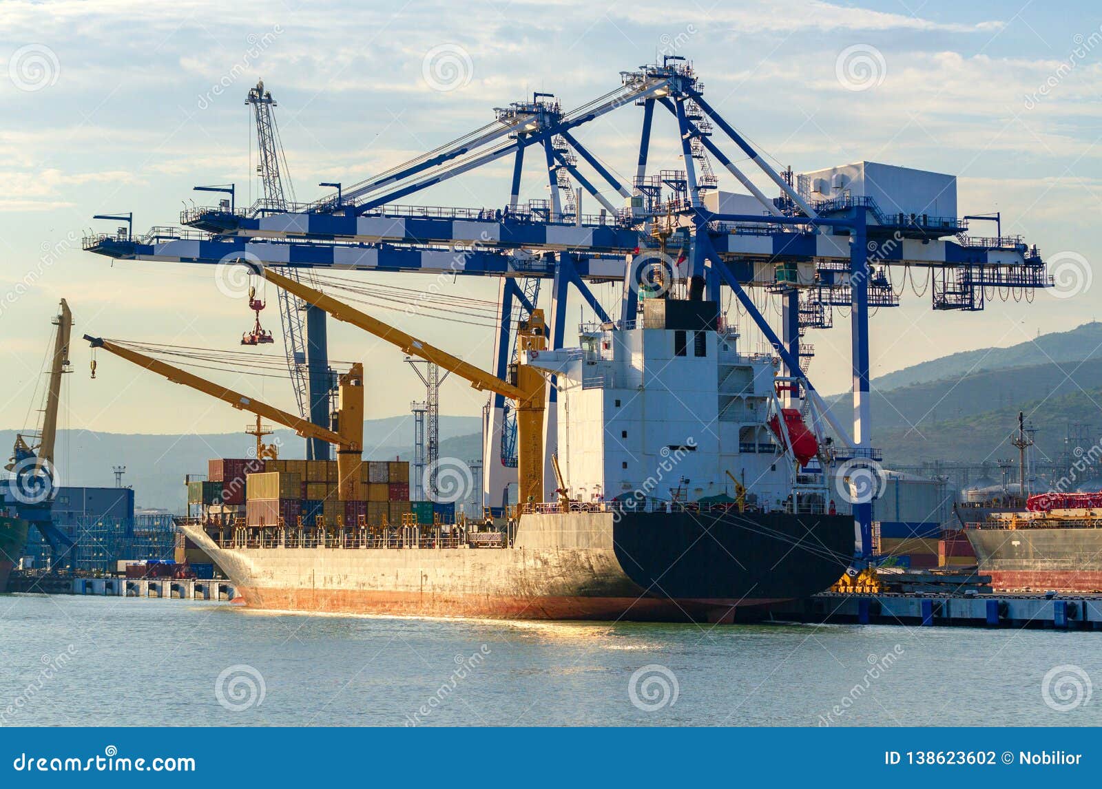 Container Ship is Loading in a Port, Evening Light Stock Photo - Image ...