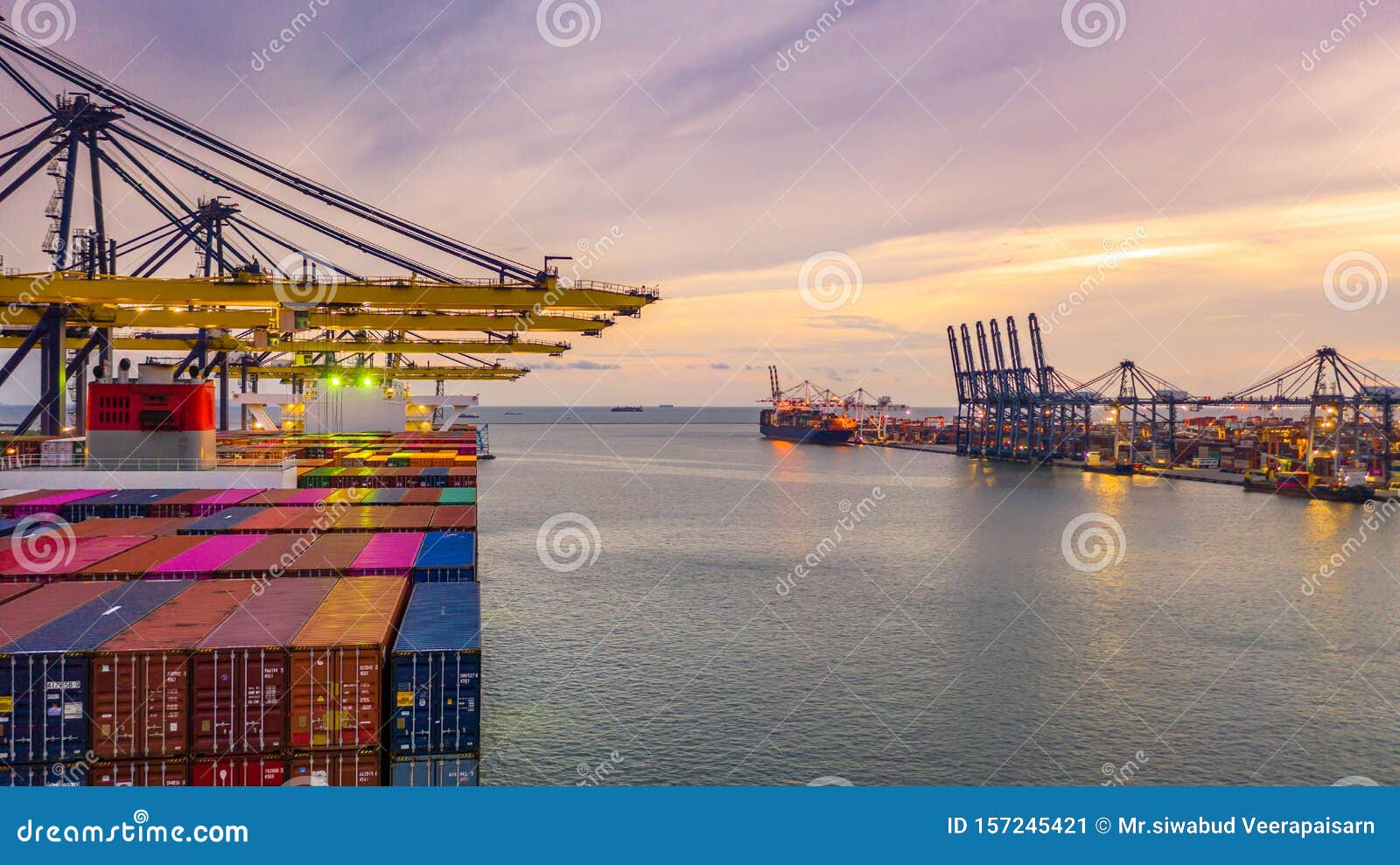 Container Ship Loading and Unloading in Deep Sea Port at Sunset, Aerial ...