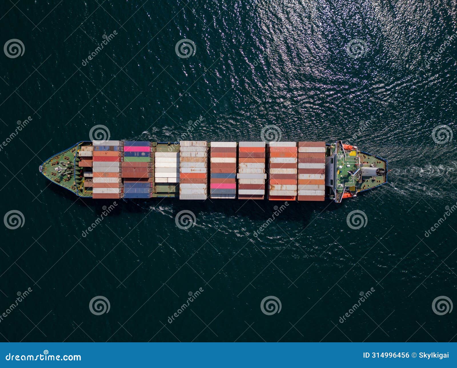 A Container Ship Moves Steadily through the Ocean, Carrying Stacked ...
