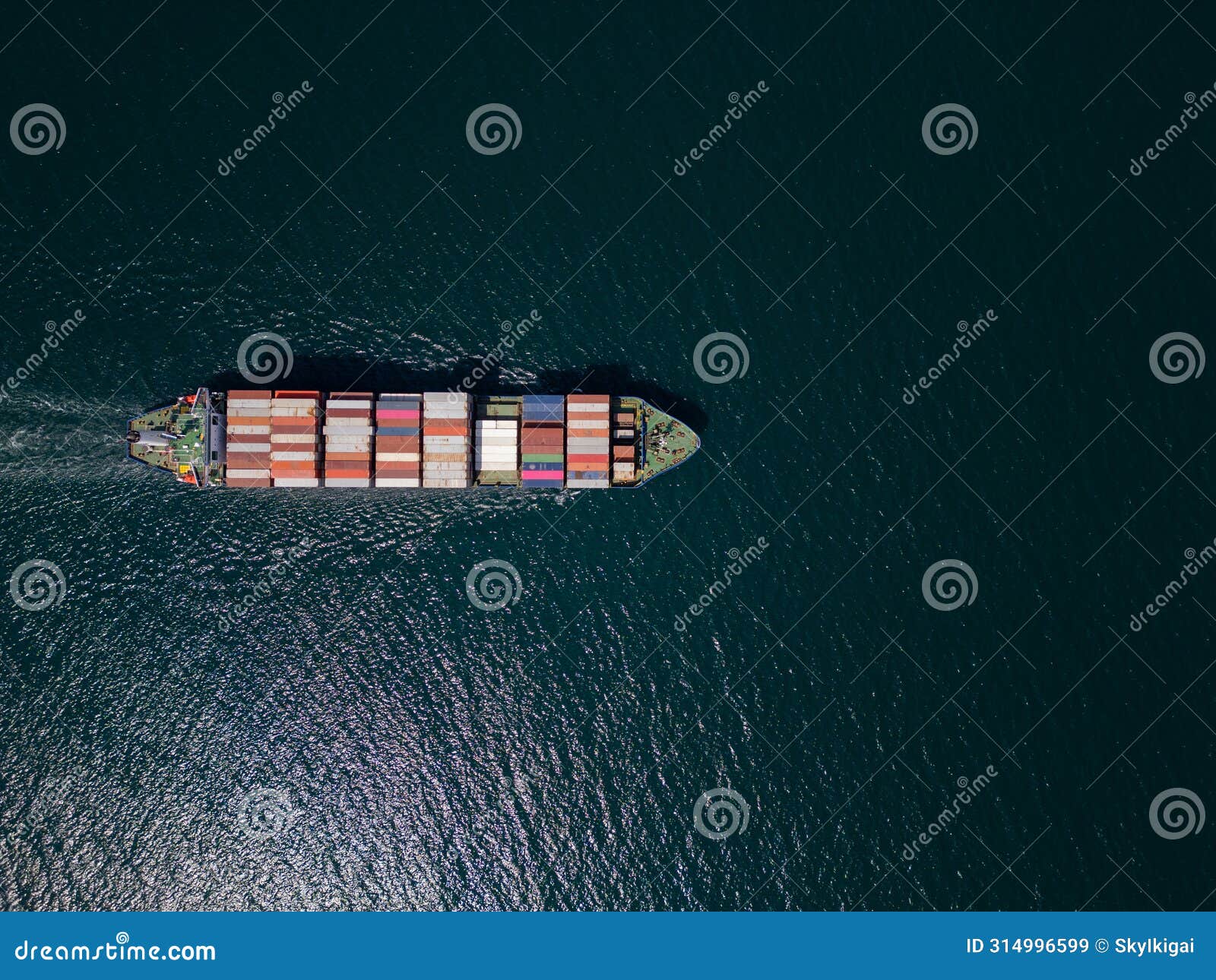 A Container Ship Moves Steadily through the Ocean, Carrying Stacked ...