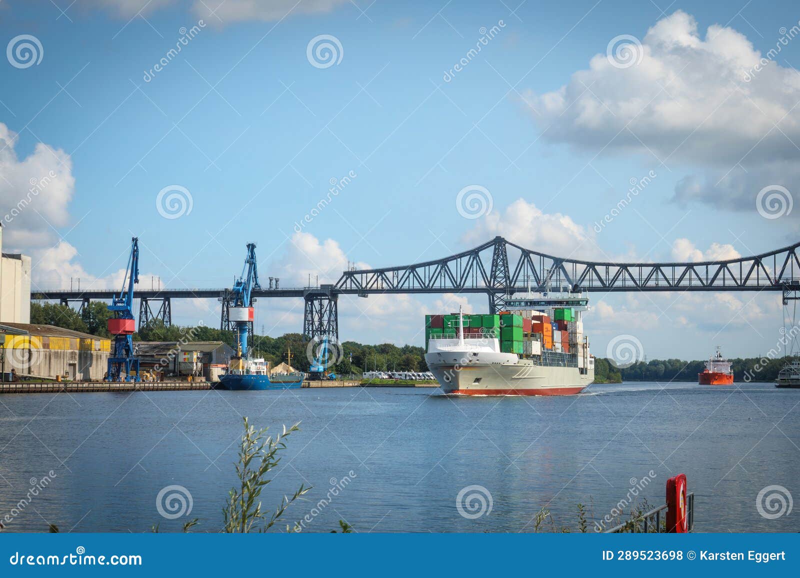 A Container Ship Passes Under the Rendsburg High Bridge Stock Photo ...