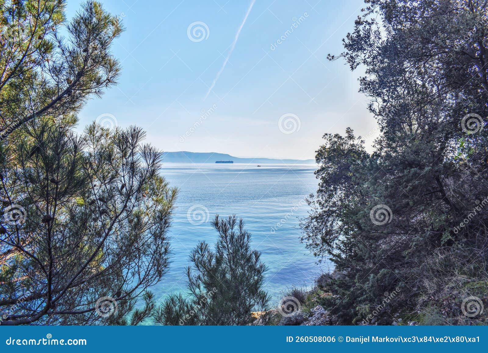 A Container Ship Slowly Sails in the Distance. Stock Photo - Image of ...