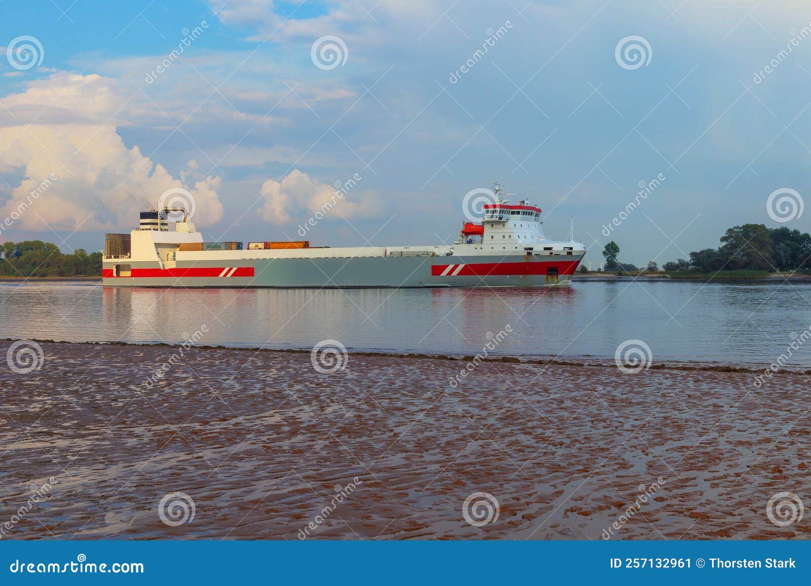 Container Ship on a River at Low Tide with Blue Sky Stock Image - Image ...