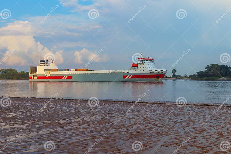 Container Ship on a River at Low Tide with Blue Sky Stock Image - Image ...