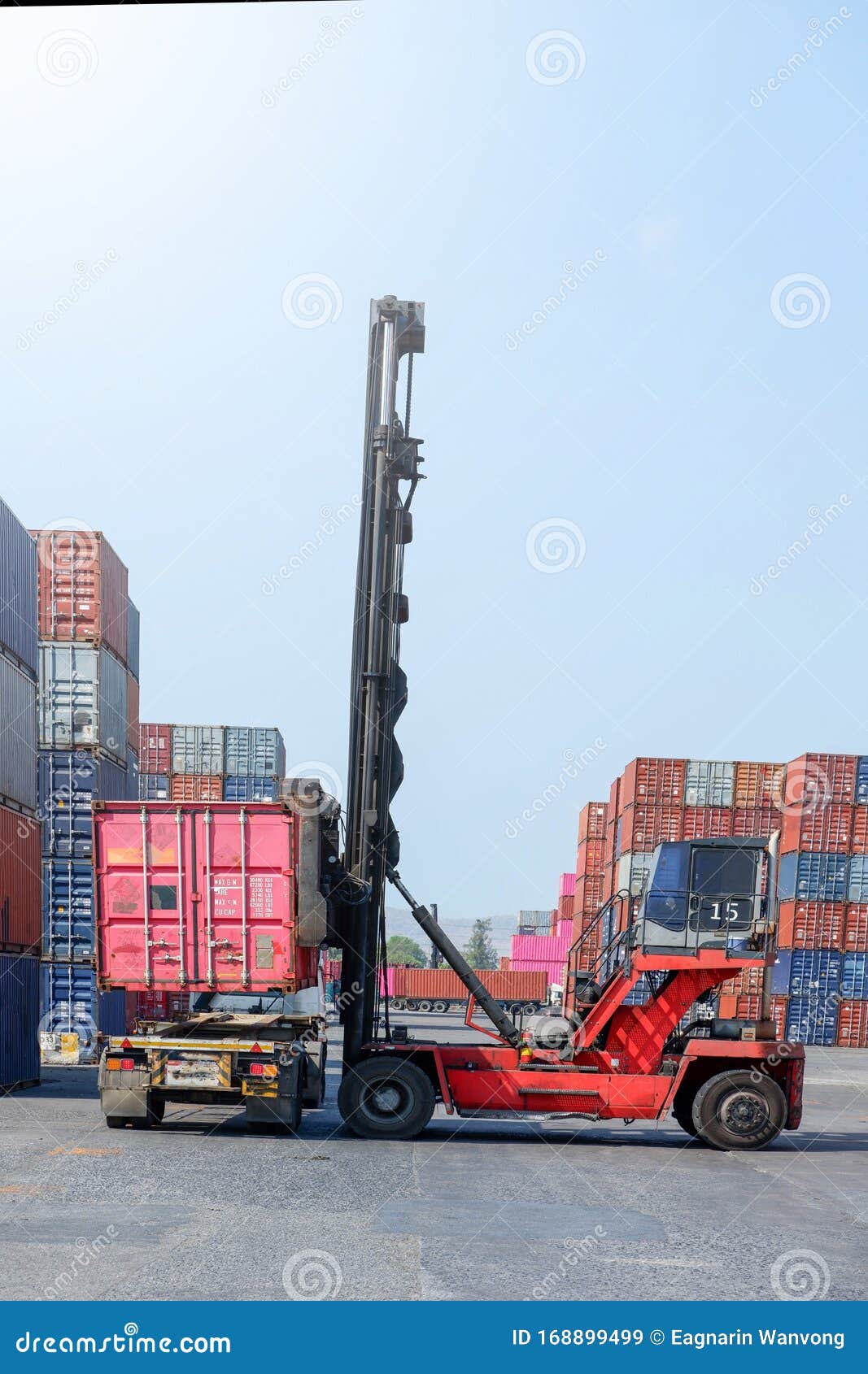 Container Handlers are Loading Containers into Trucks Stock Image ...