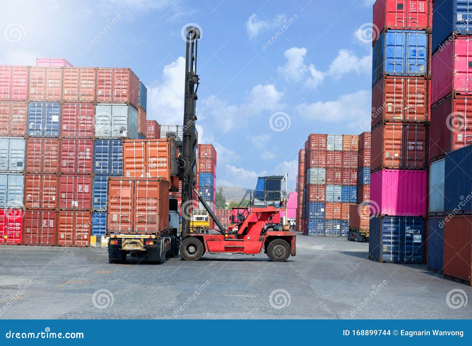 Container Handlers are Loading Containers into Trucks Stock Photo ...