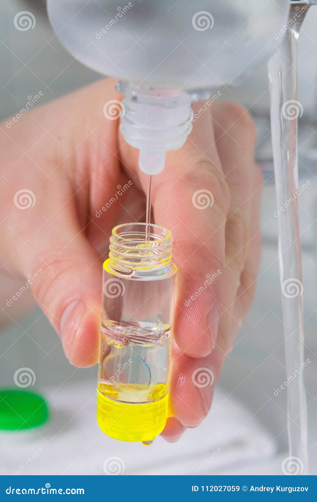 In the Container for Storing the Lenses for the Eyes, Pour the Liquid ...