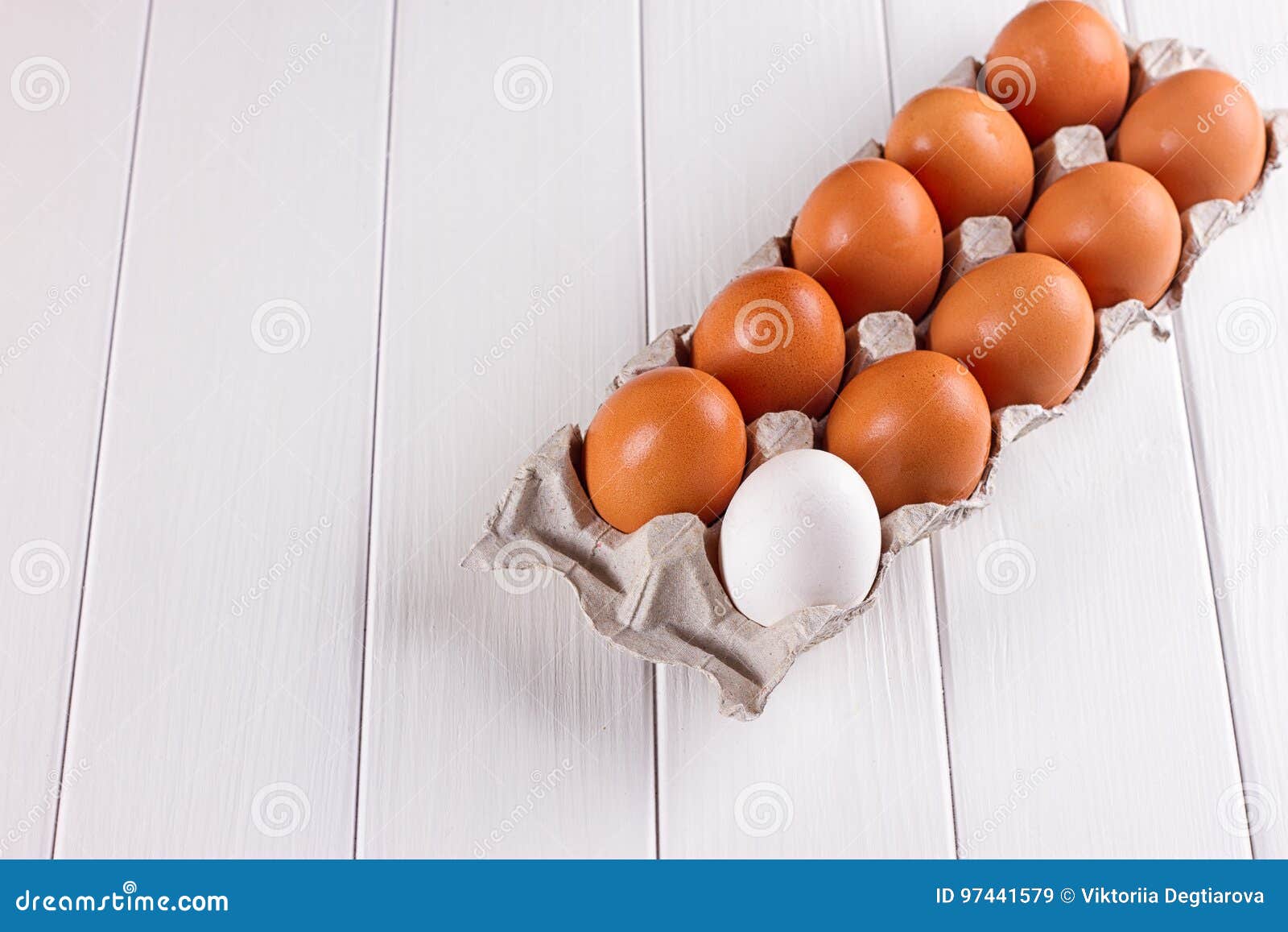Container of Ten Eggs. Nine Eggs Brown One Egg White Stock Image ...