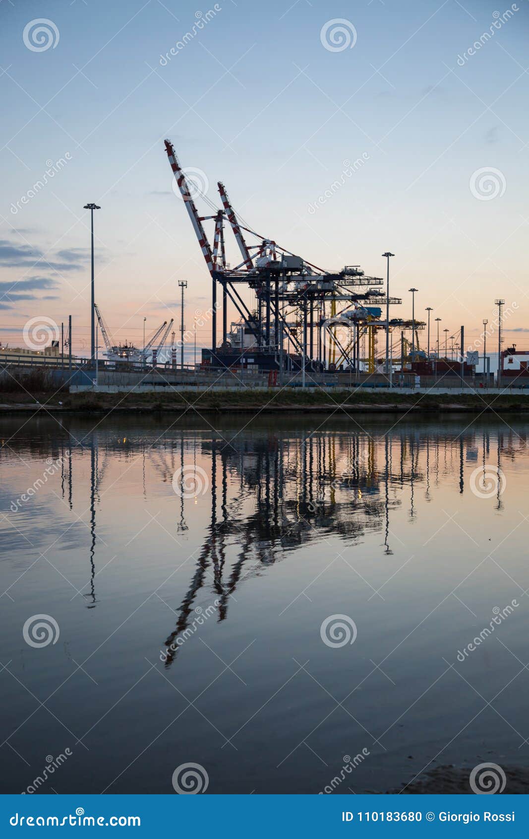 Container Terminal, Shipyard and Cranes at Sunset and Their Reflection ...