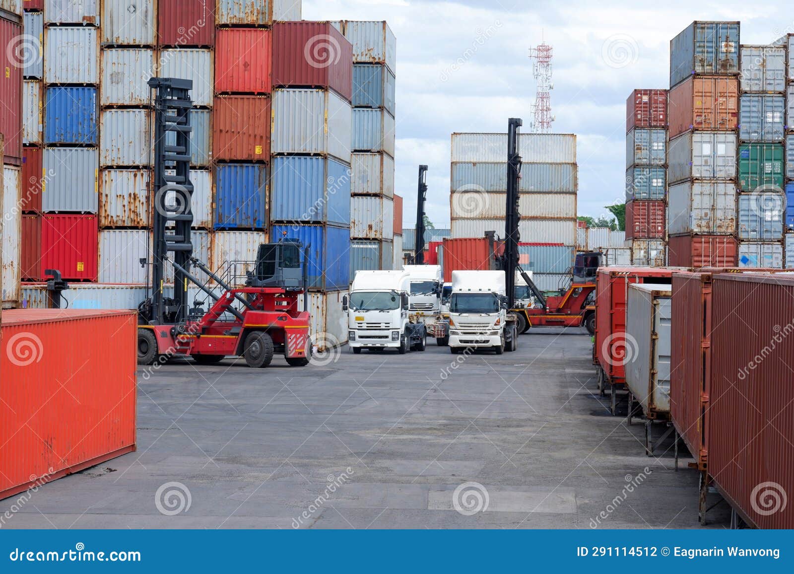 Container Truck and Container Forklifts Located Behind a Pile of ...
