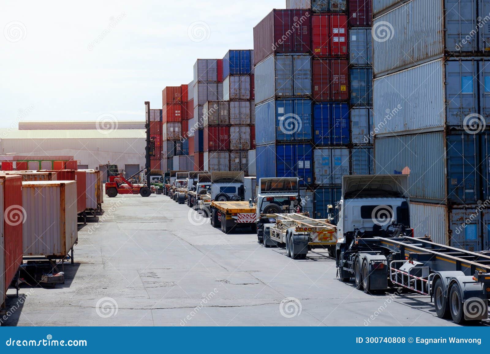 Container Truck and Container Forklifts Located Behind a Pile of ...