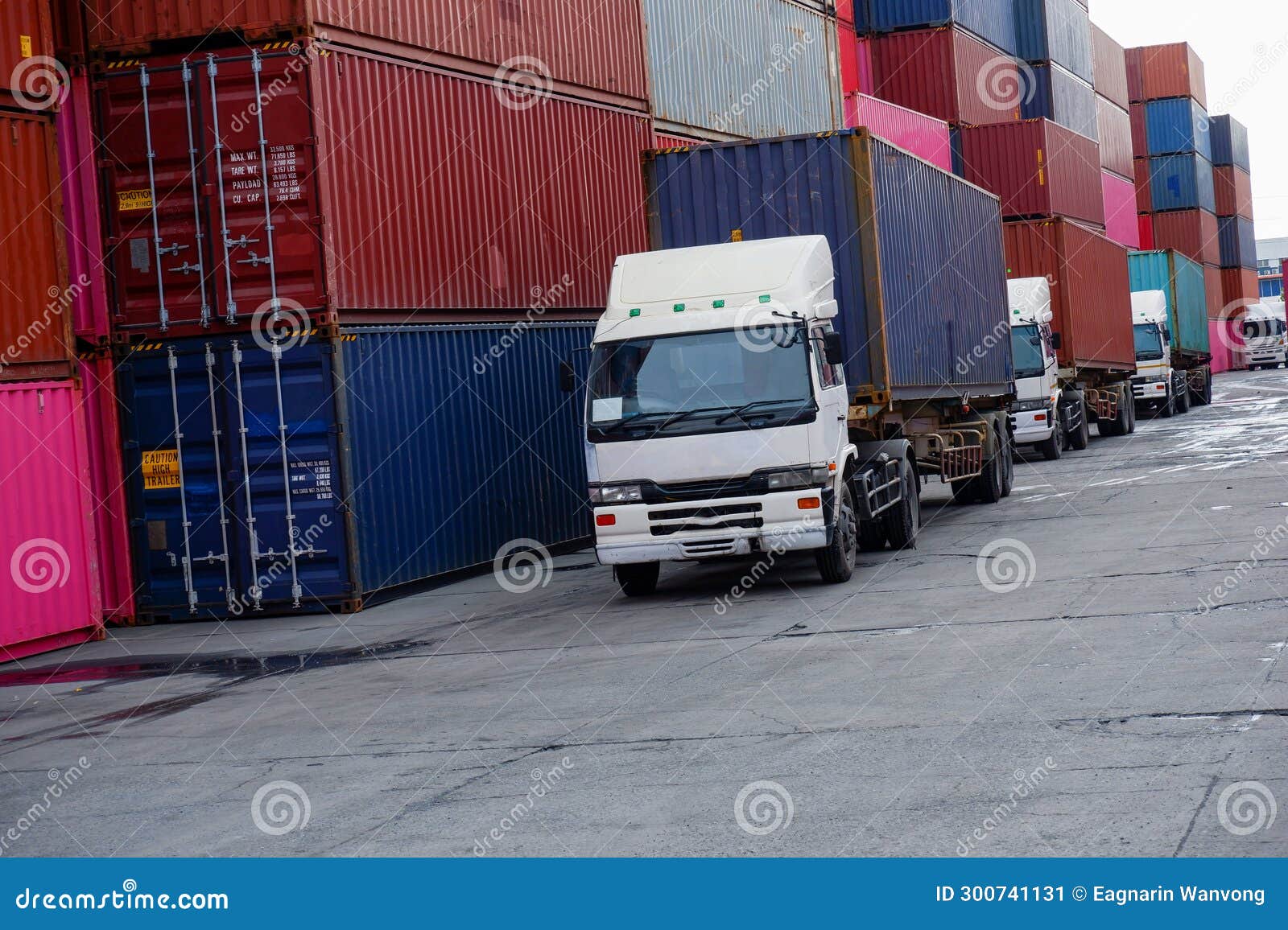 A Container Truck Sits Behind a Pile of Containers Stock Image - Image ...