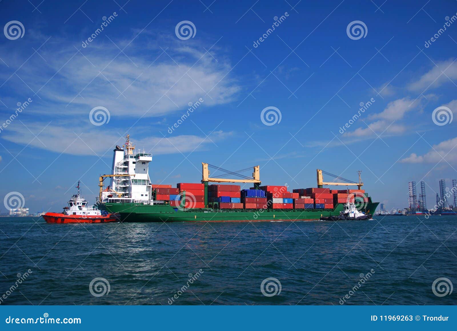 Container Vessel Berthing At An Industrial Port. Tugboat Push Large ...