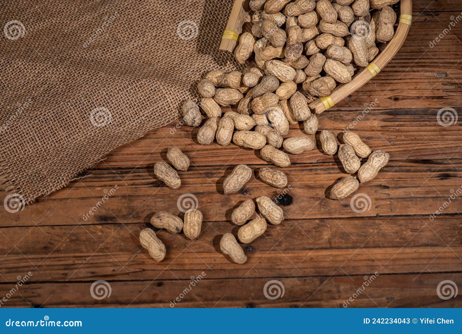 The Container on the Wood Grain Table is Full of Peanuts Stock Image ...