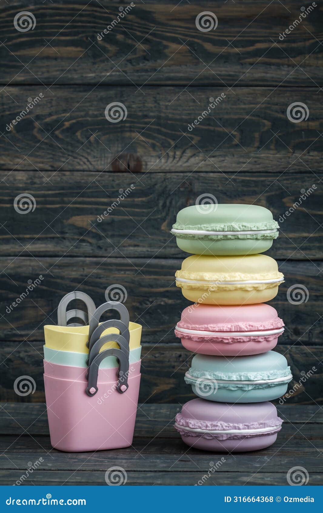 Containers Next To a Stack of Macaron Shaped Storage Boxes Stock Photo ...