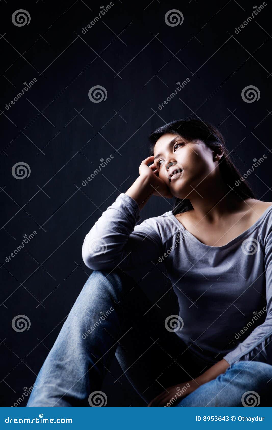 Contemplate woman in dark stock image. Image of young - 8953643
