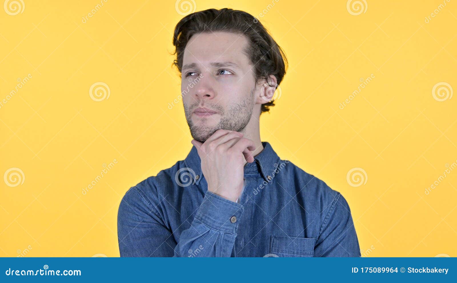 Contemplative Young Man Thinking New Idea on Yellow Background Stock ...