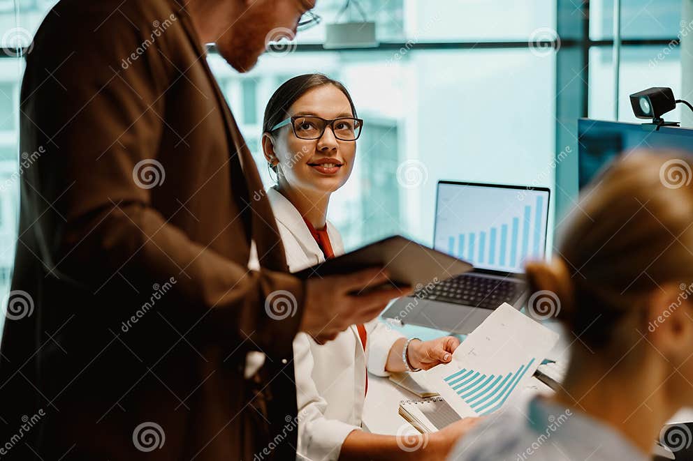 Collaborative Business Meeting Focused on Data Analysis and Strategies ...