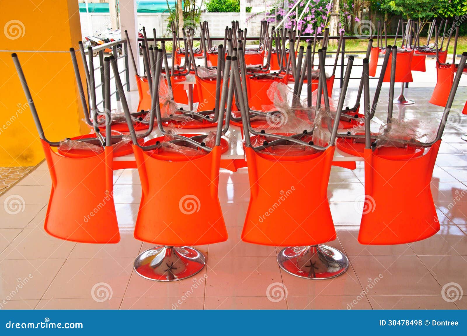 Contemporary Orange Plastic Chair Stock Photo - Image of chair ...