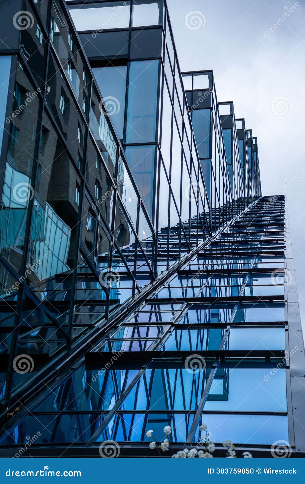 Contemporary Tall Building Features a Striking Blue Glass Facade Stock ...