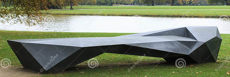 A Contemporary Wooden Bench with an almost Pentagonal Shape, Showcasing ...