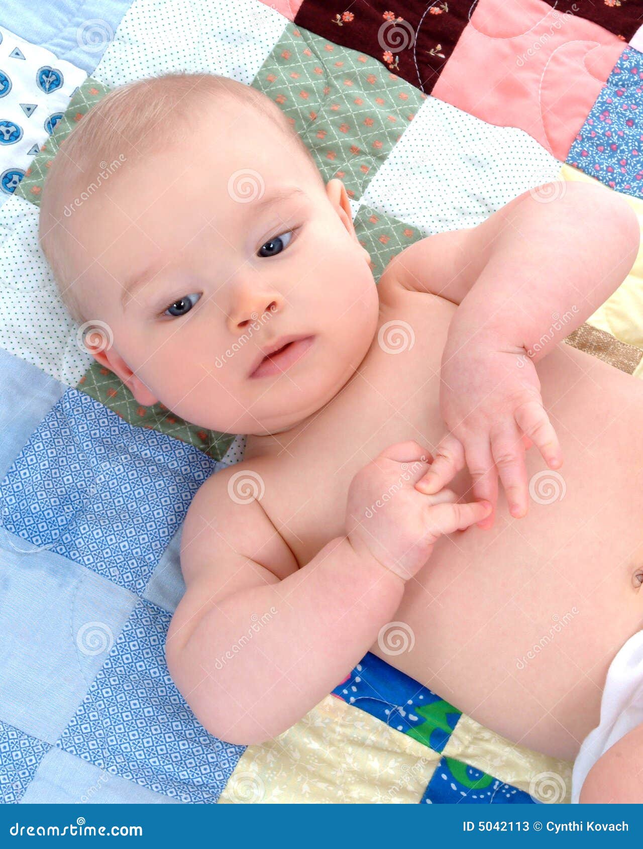 Content Baby on Quilt stock image. Image of multicolor - 5042113