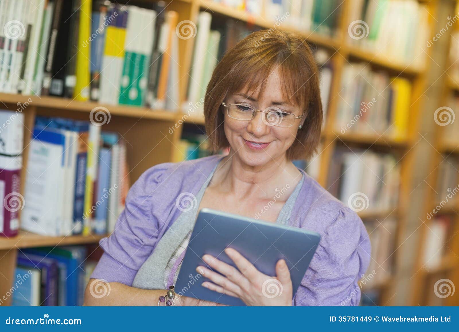 Content Mature Librarian Using Her Tablet Stock Image - Image of ...