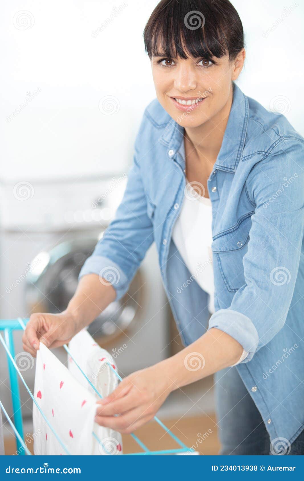 Content Woman Hanging Clothes on Clothes Line Stock Photo - Image of ...