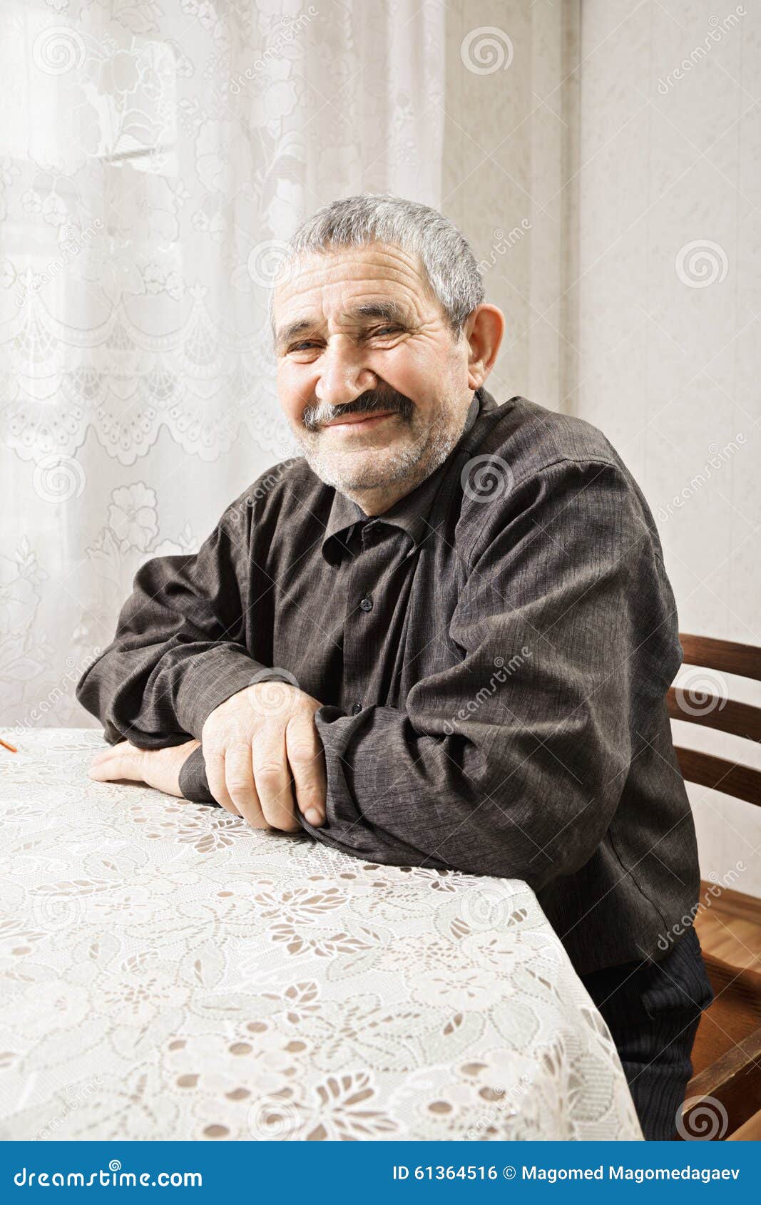 Contented Senior Man at the Table Stock Photo - Image of serious ...