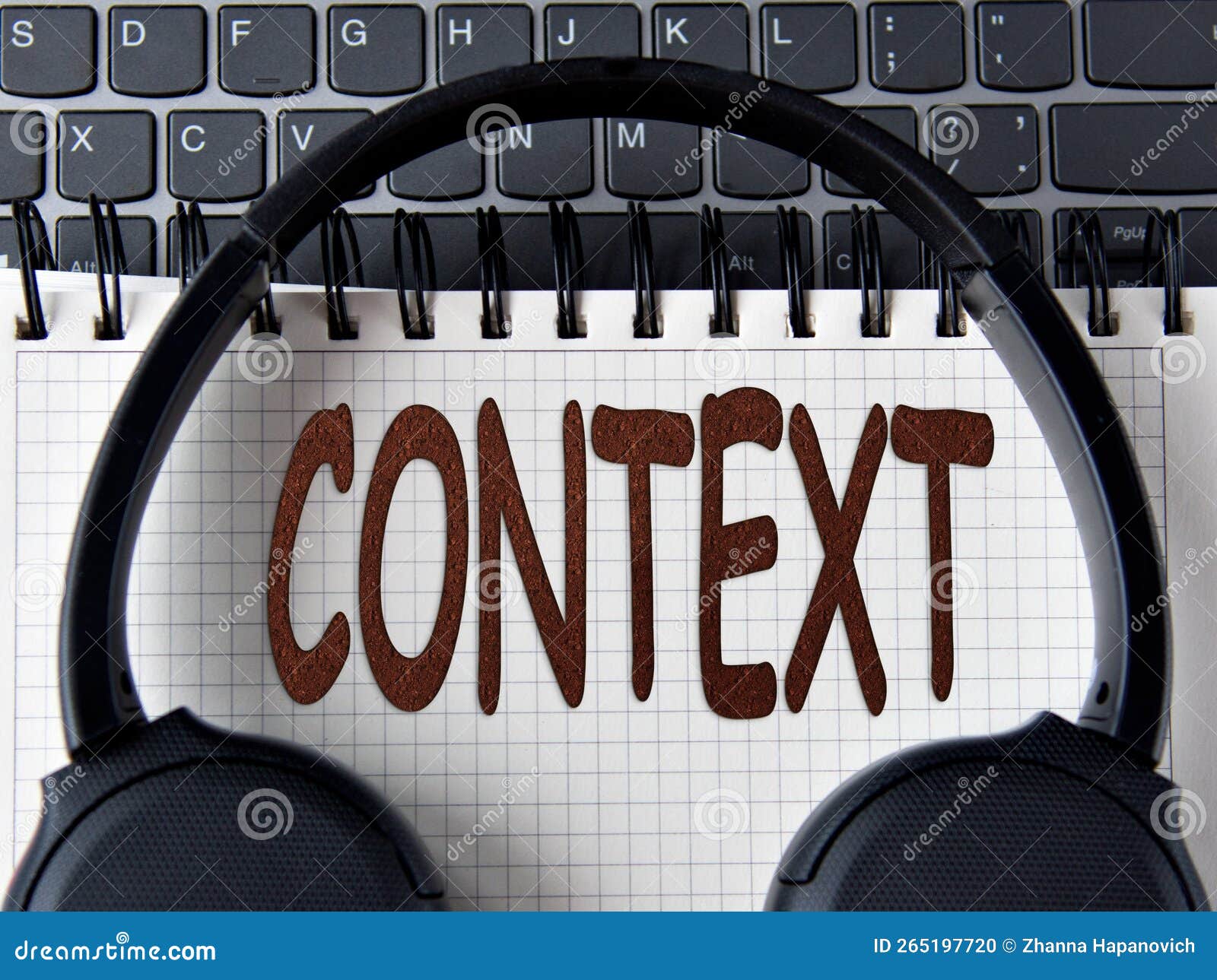 CONTEXT -word on White Notepad with Keyboard and Headphone Background ...