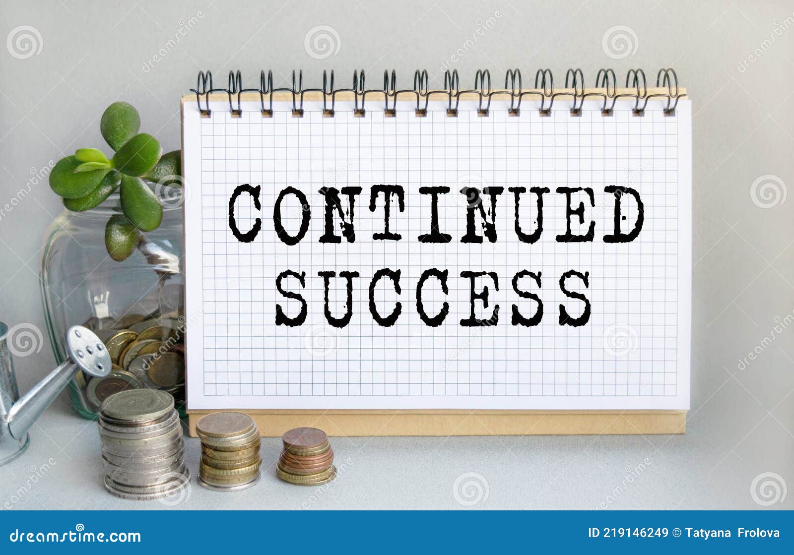 CONTINUED SUCCESS is Written in a Notebook that Sits on the Table Along ...