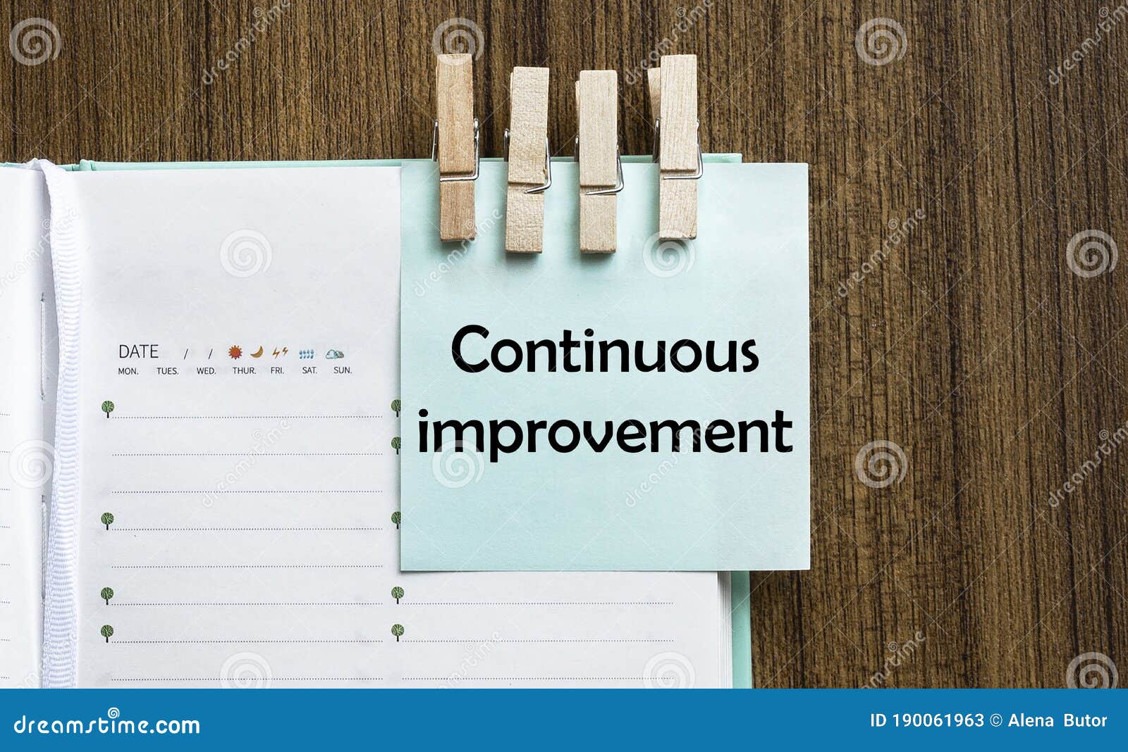 Continuous Improvement Notes Paper and a Clothes Pegs on Wooden ...