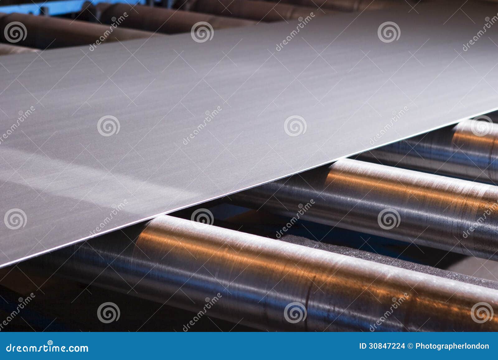 Continuous Sheet of Metallic Material Being Fed through Machine Stock ...