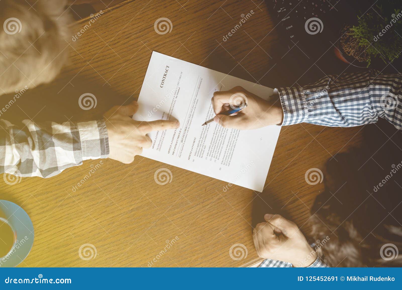 Contract Document, Two Men Sign Paper in the Office a Toned Faded Image ...