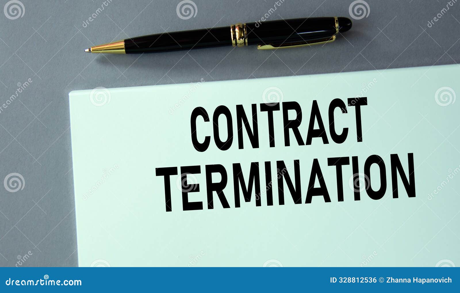 CONTRACT TERMINATION - Words on a Piece of Paper with a Pen on a Gray ...
