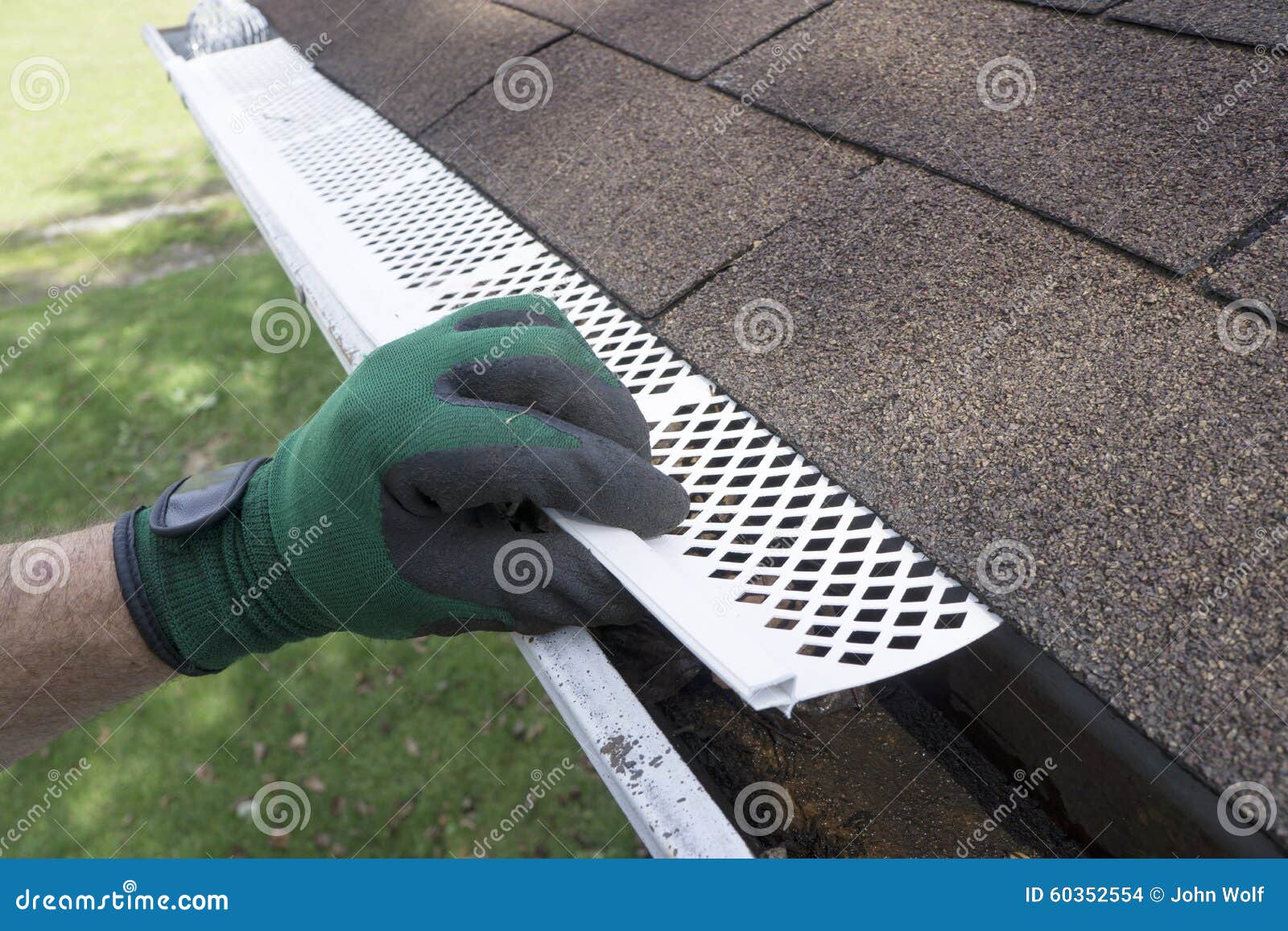 Contractor Adjusting Plastic Gutter Guards Stock Photo - Image of ...